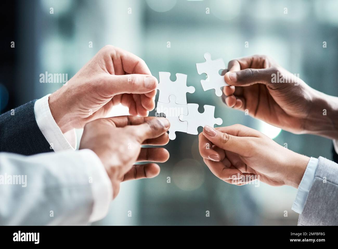 Business team building puzzle pieces hi-res stock photography and ...