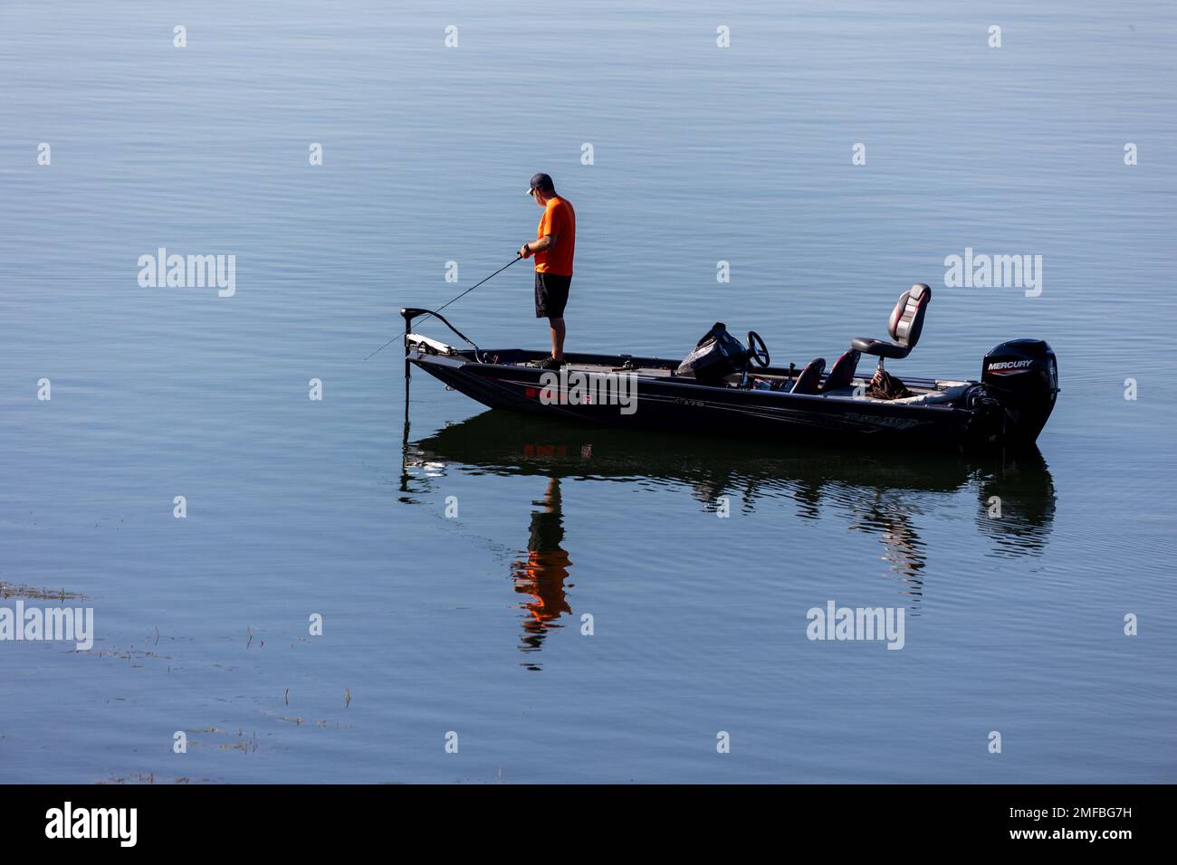 A visitor fishes at Michael J. Kirwan Dam and Reservoir in Wayland ...