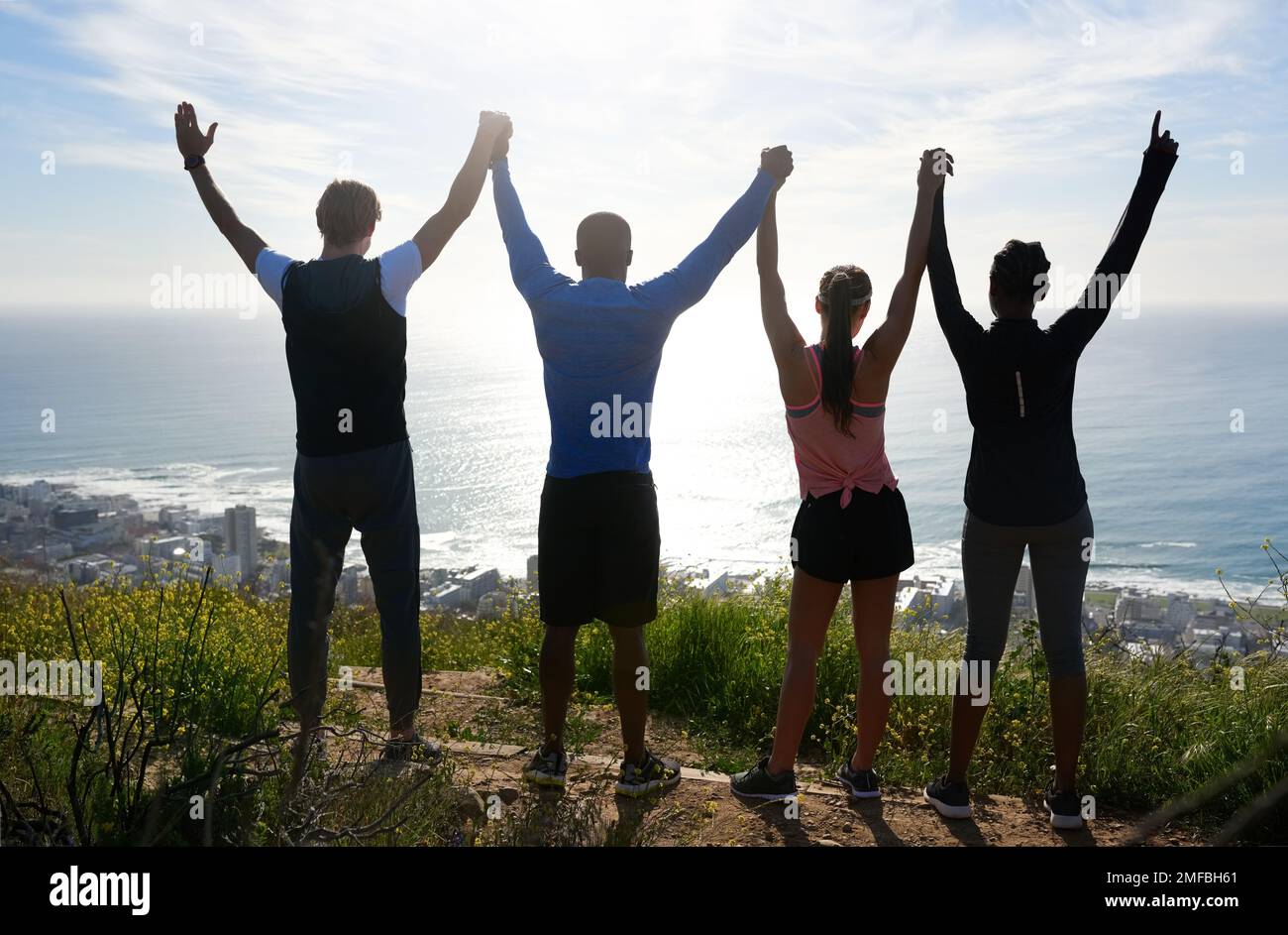 Were working on bettering ourselves. a group of people raising their ...