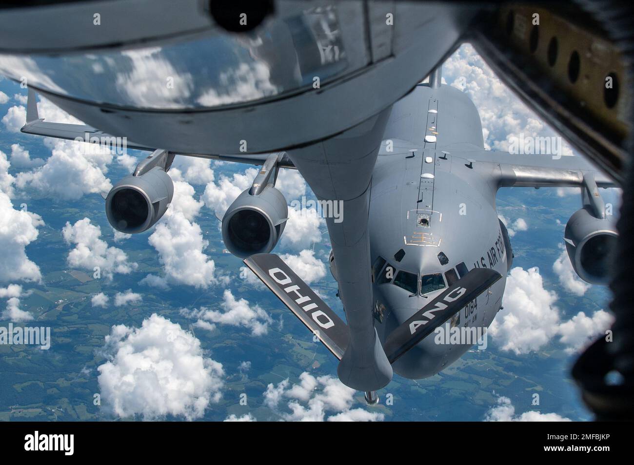 A KC-135 Stratotanker from the 121st Air Refueling Wing refuels a C-17 ...