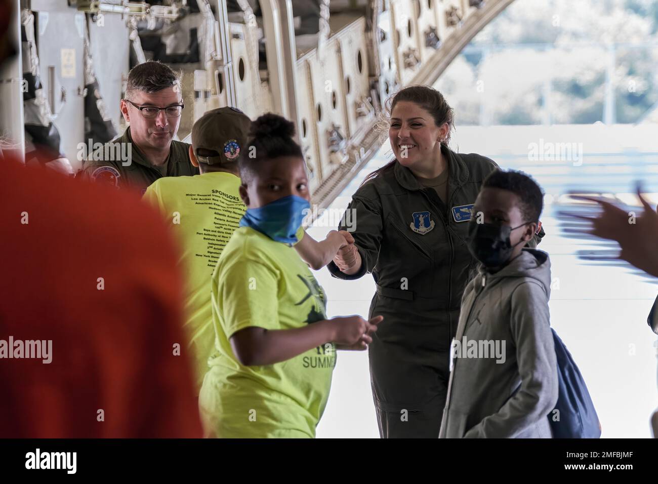 Senior Airman Christen Mills and Master Sgt. John Neumann greet ...