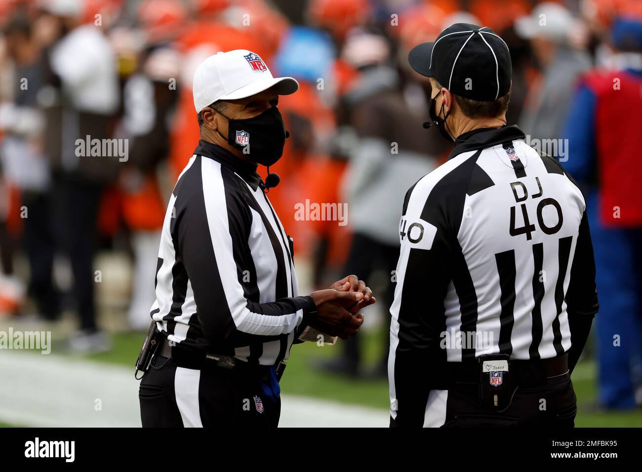 Referee Jerome Boger (23) talks with down judge Brian Bolinger (40 ...