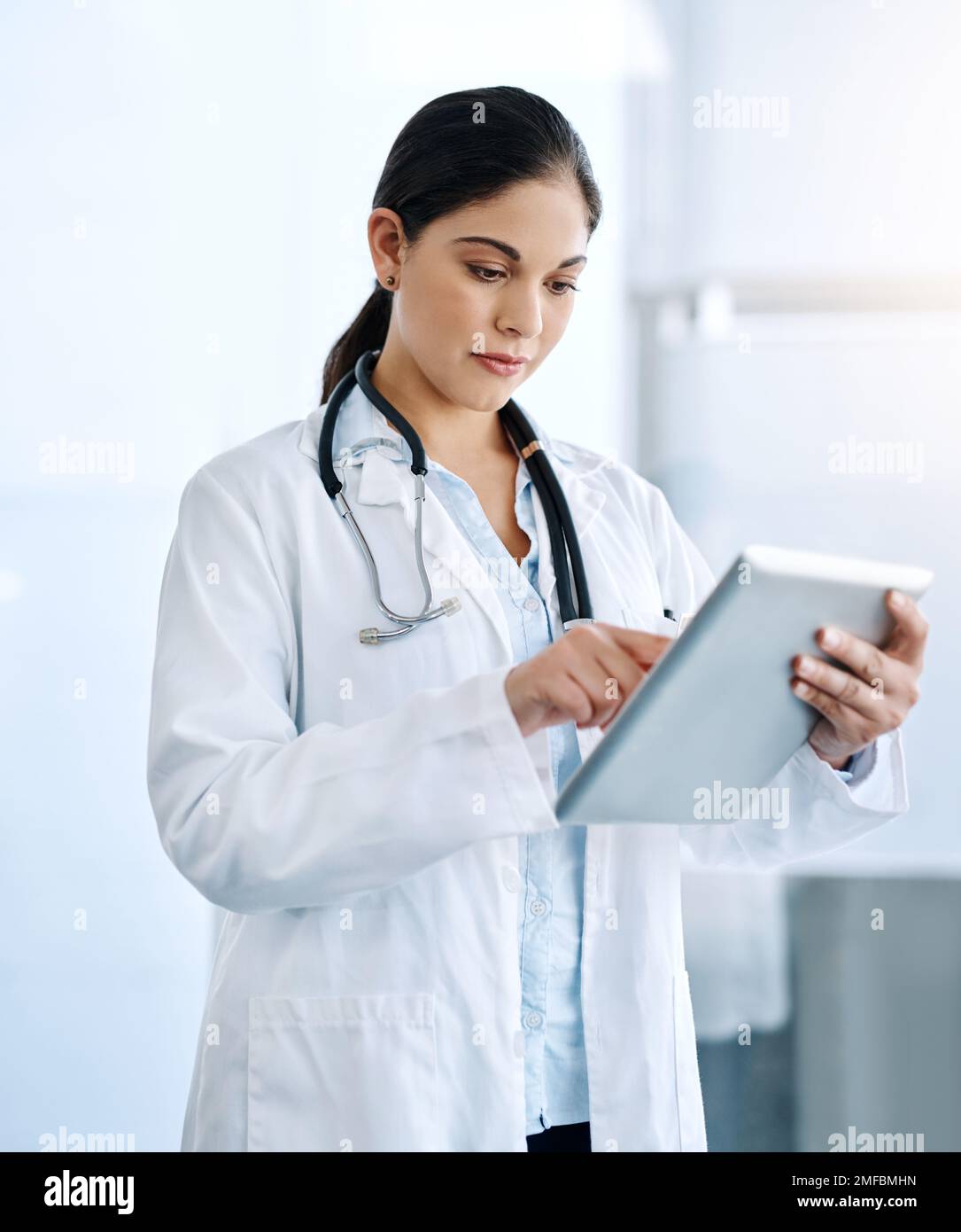 Its one way to connect with patients as well. a young female doctor ...