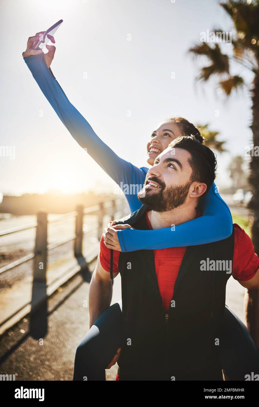 Working out together strengthens the relationship. a woman taking a ...