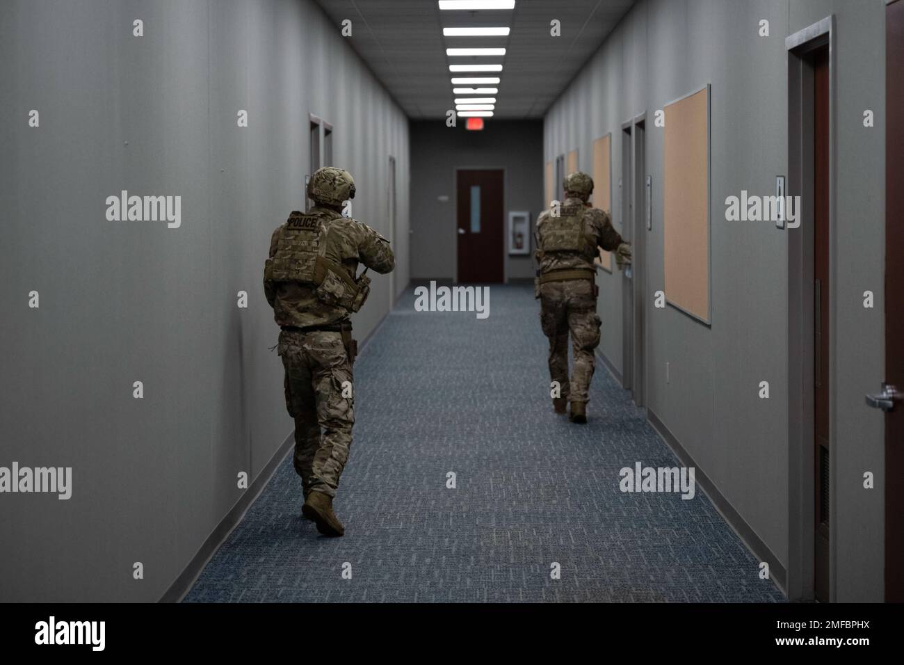 Airmen assigned to the 4th Security Forces Squadron sweep a building during an active shooter ...