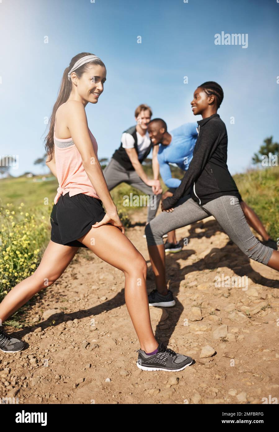 Stretching makes all the difference. a fitness group stretching before ...