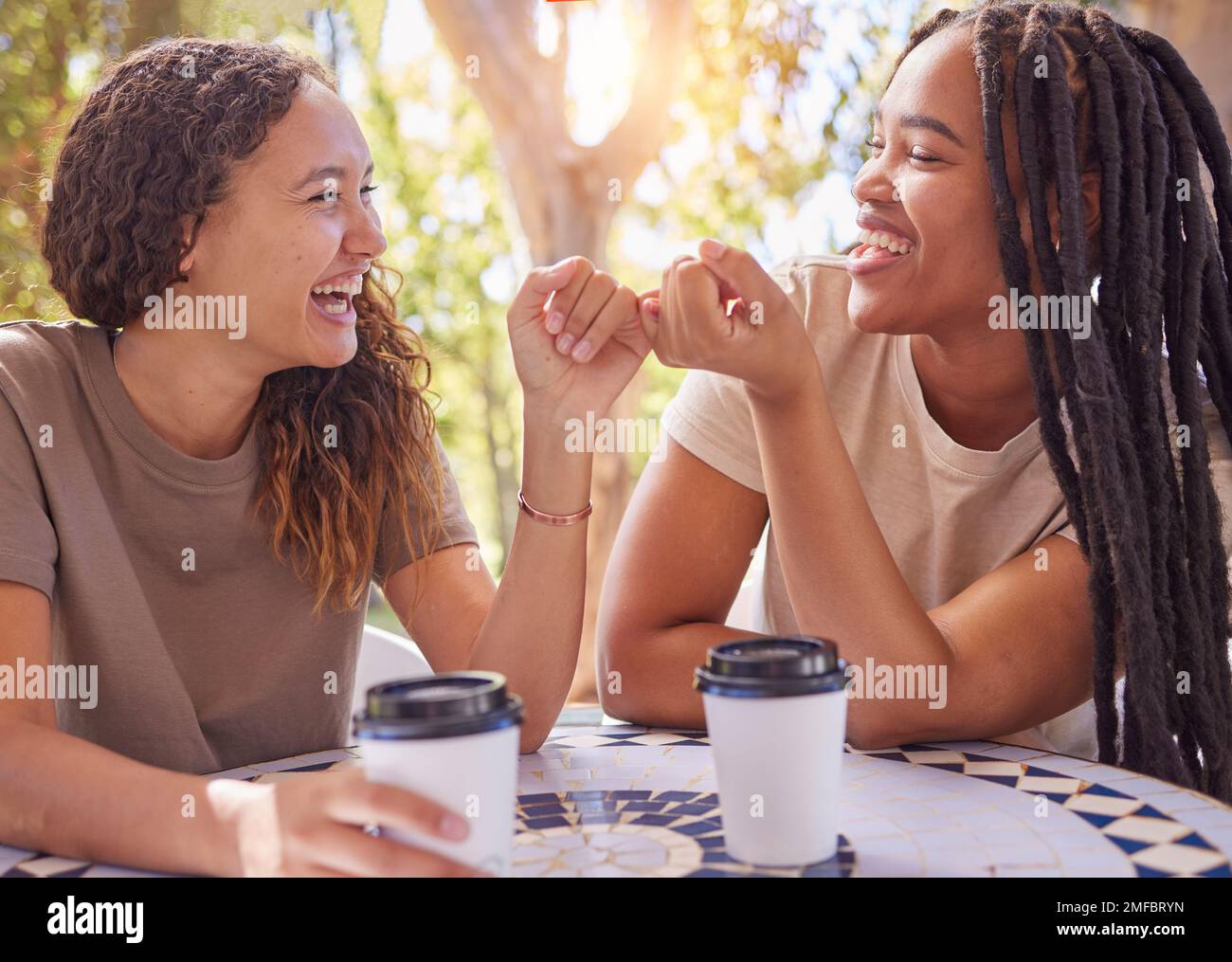 Happy, pinky promise and women friends in nature enjoying coffee ...