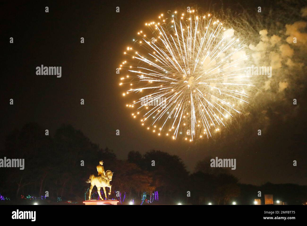 Fireworks released from Naypyitaw City Hall billow near statue of Gen ...