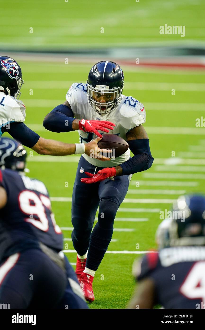 Tennessee Titans running back Derrick Henry (22) takes the handoff ...