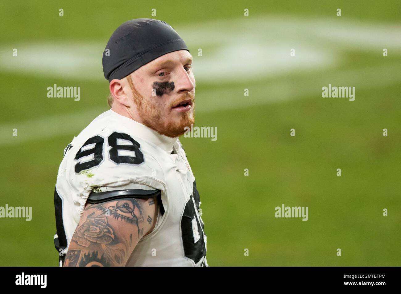 Las Vegas Raiders defensive end Maxx Crosby (98) looks on from the ...