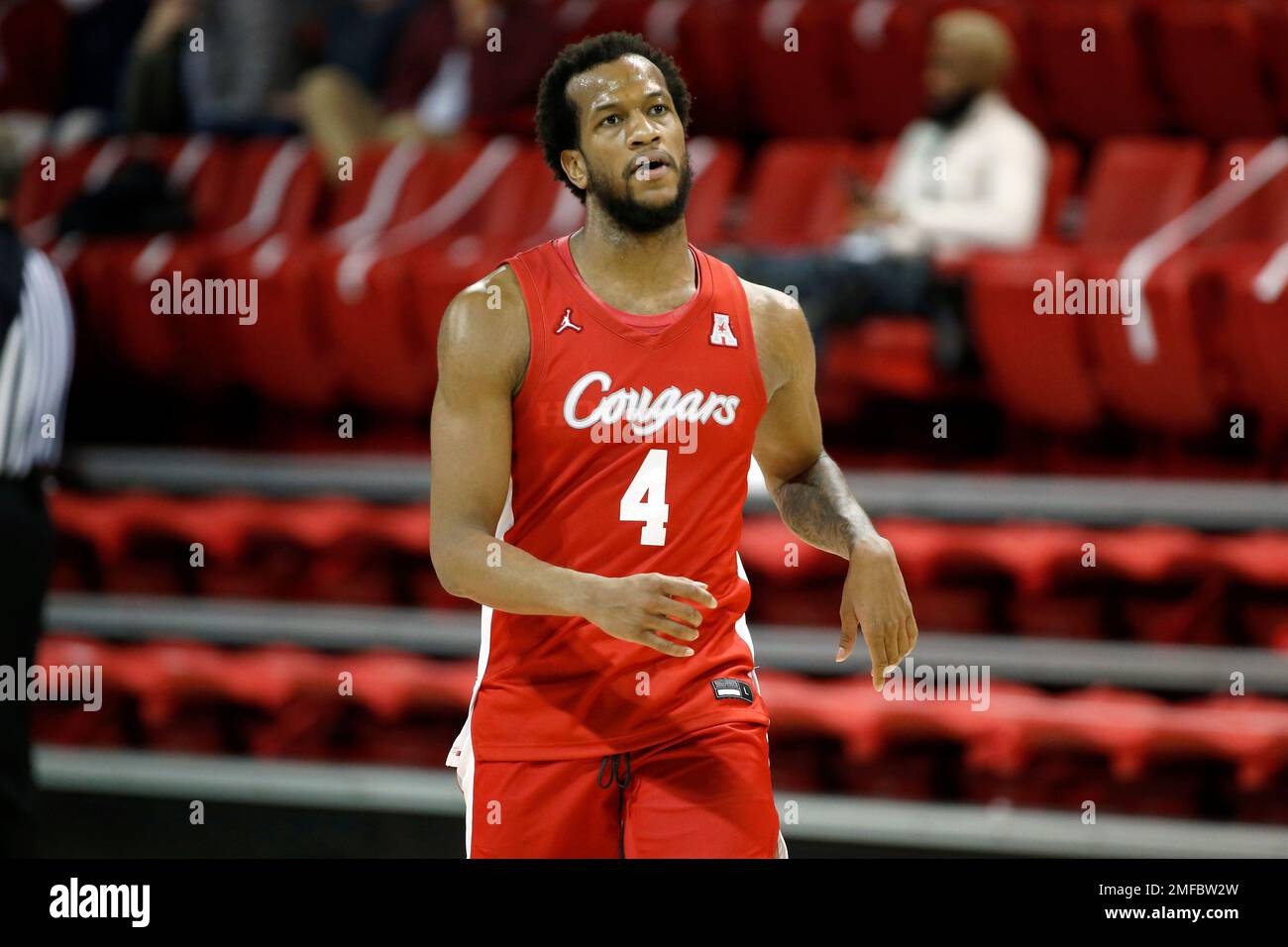 Houston forward Justin Gorham (4) walks up the court during the second ...