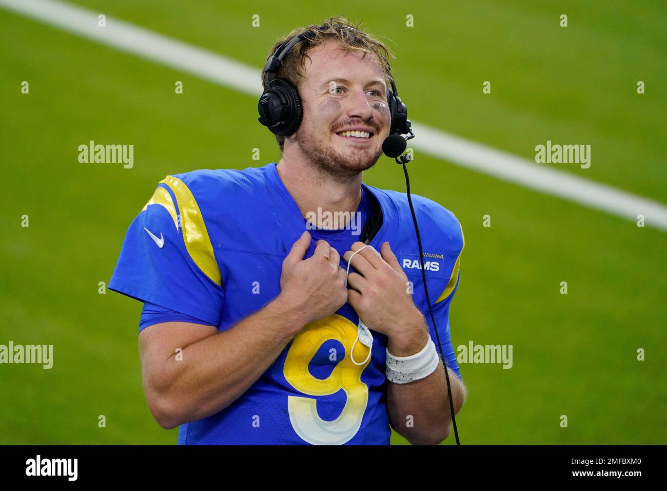 Los Angeles Rams quarterback John Wolford (9) smiles while interviewed ...
