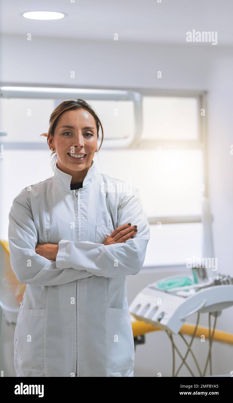 We take care of your teeth. Portrait of a cheerful young female dentist ...