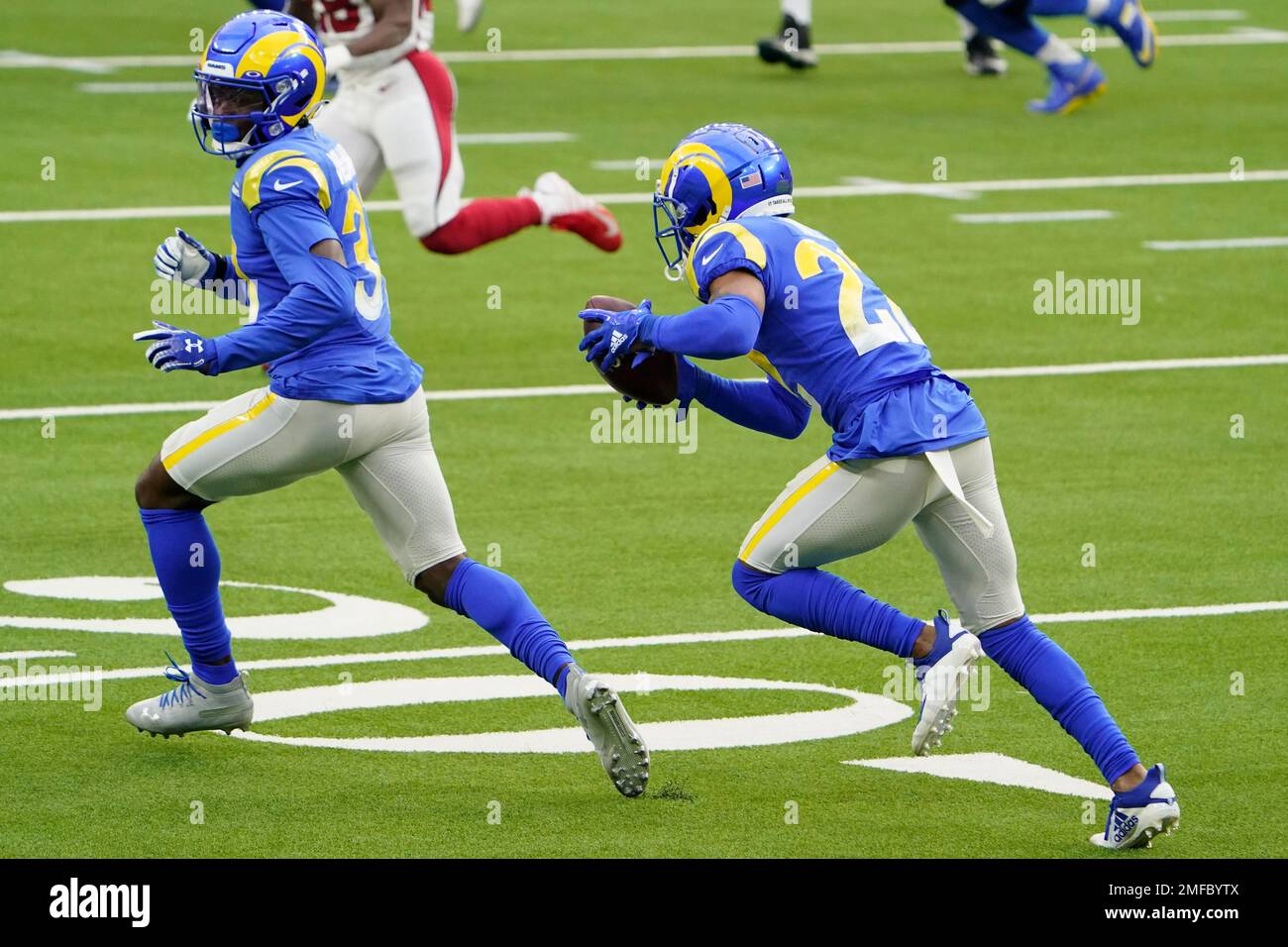 Los Angeles Rams cornerback Troy Hill, right, returns an interception ...