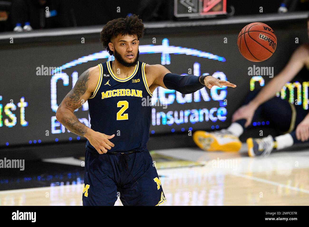 Michigan forward Isaiah Livers (2) passes during the first half of an ...