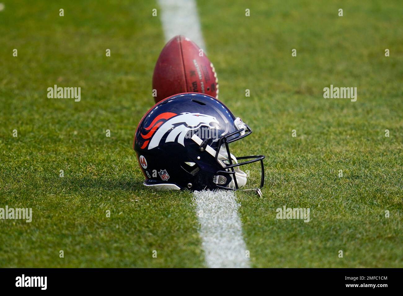 Denver Broncos helmet on the field before an NFL football game between ...