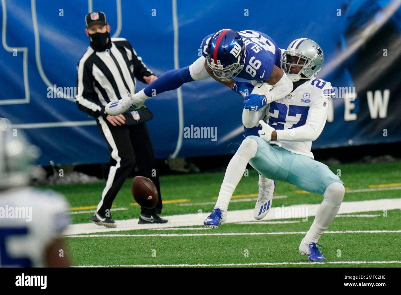 Dallas Cowboys' Trevon Diggs, right, breaks up a pass intended for New ...