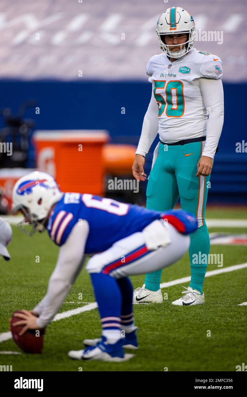 Miami Dolphins long snapper Blake Ferguson (50) watches as his brother Buffalo Bills long ...