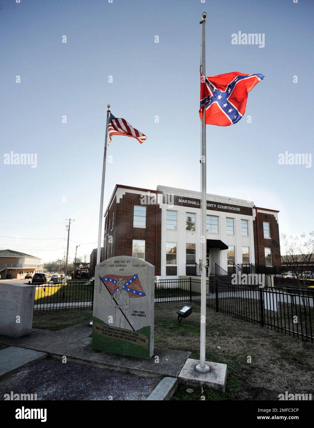 A Confederate monument and rebel battle flag are flown outside the ...
