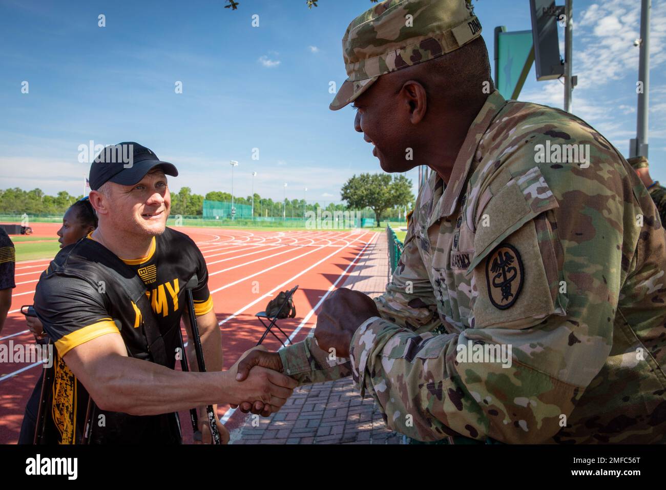 U.S. Army veteran Joshua Olson, left, meets Lt. Gen. R. Scott Dingle, U ...
