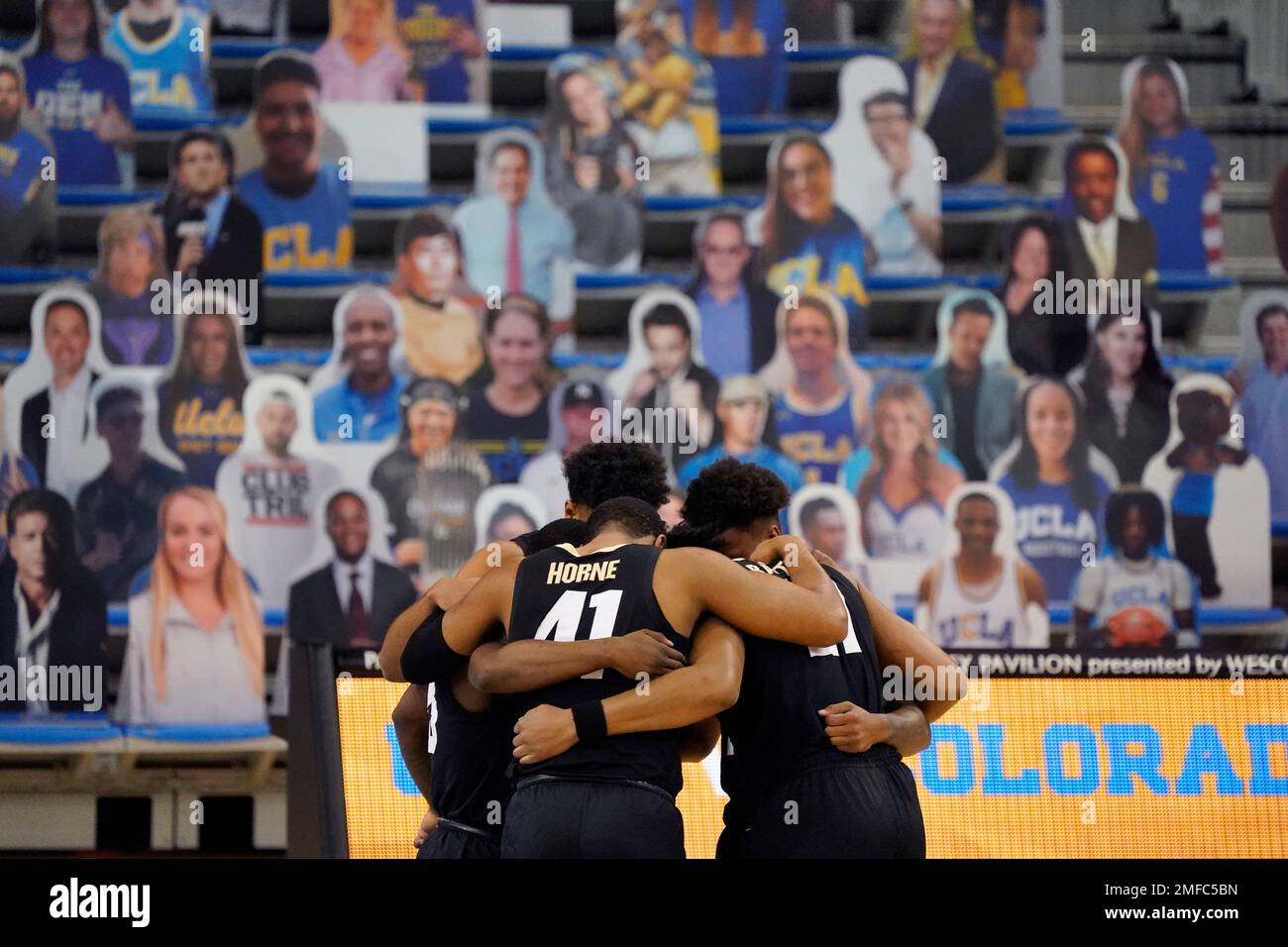 Colorado players before the start of an NCAA college basketball game ...