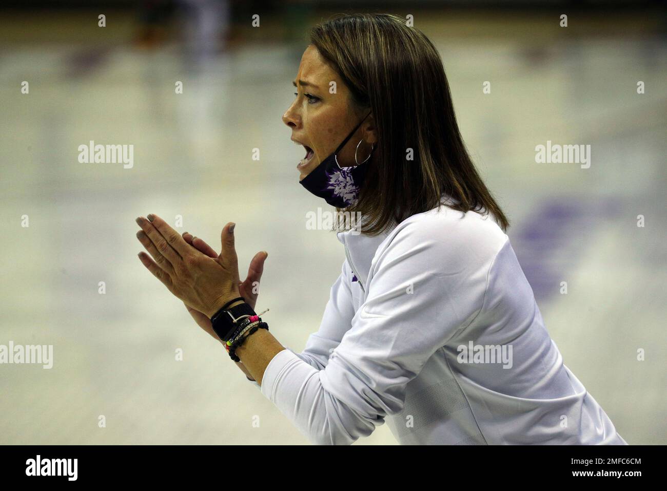TCU Associate head coach Hanna Howard claps on the sidelines during an ...