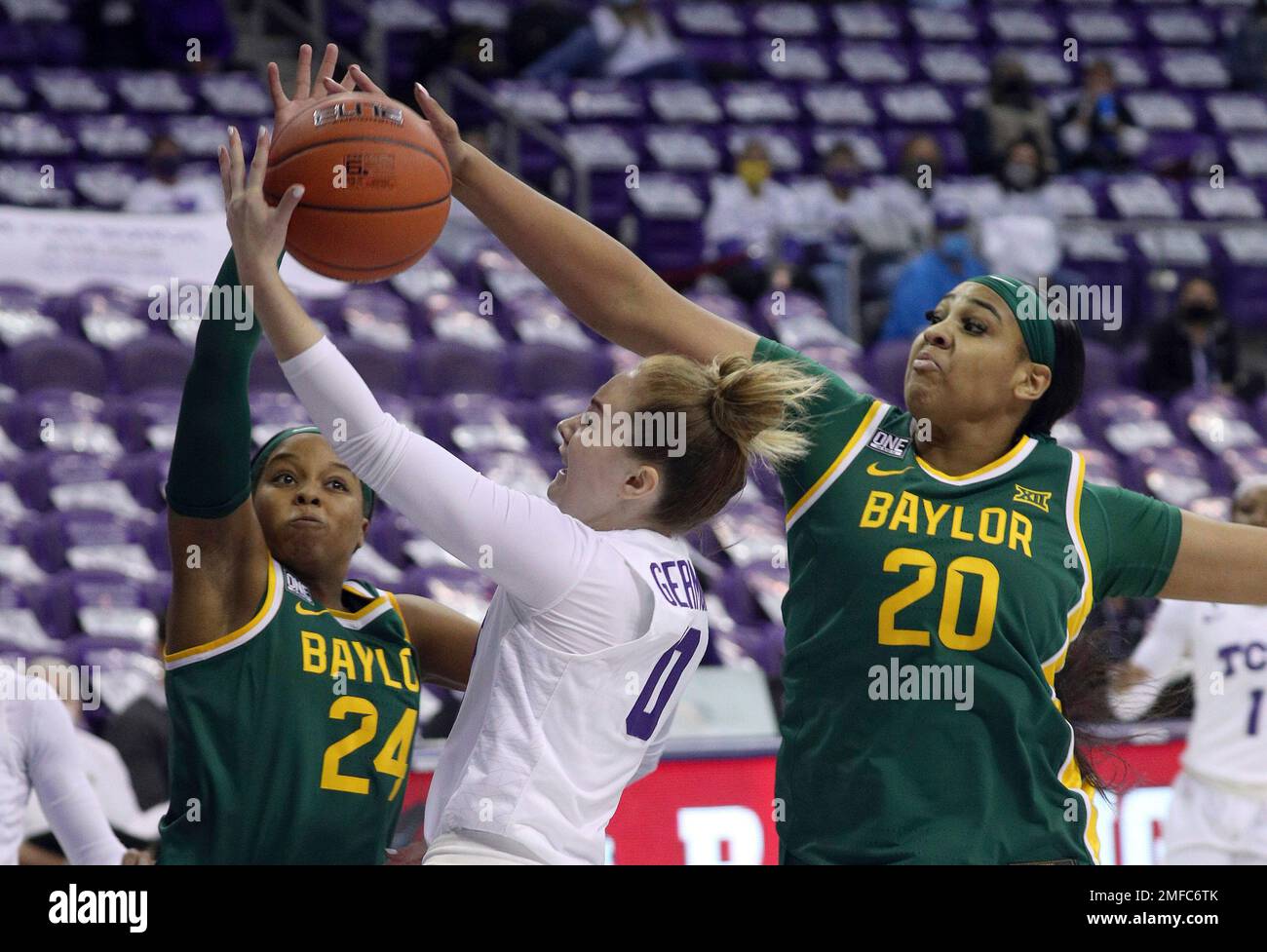 Baylor guard Sarah Andrews (24) and center Hannah Gusters (20) defend ...