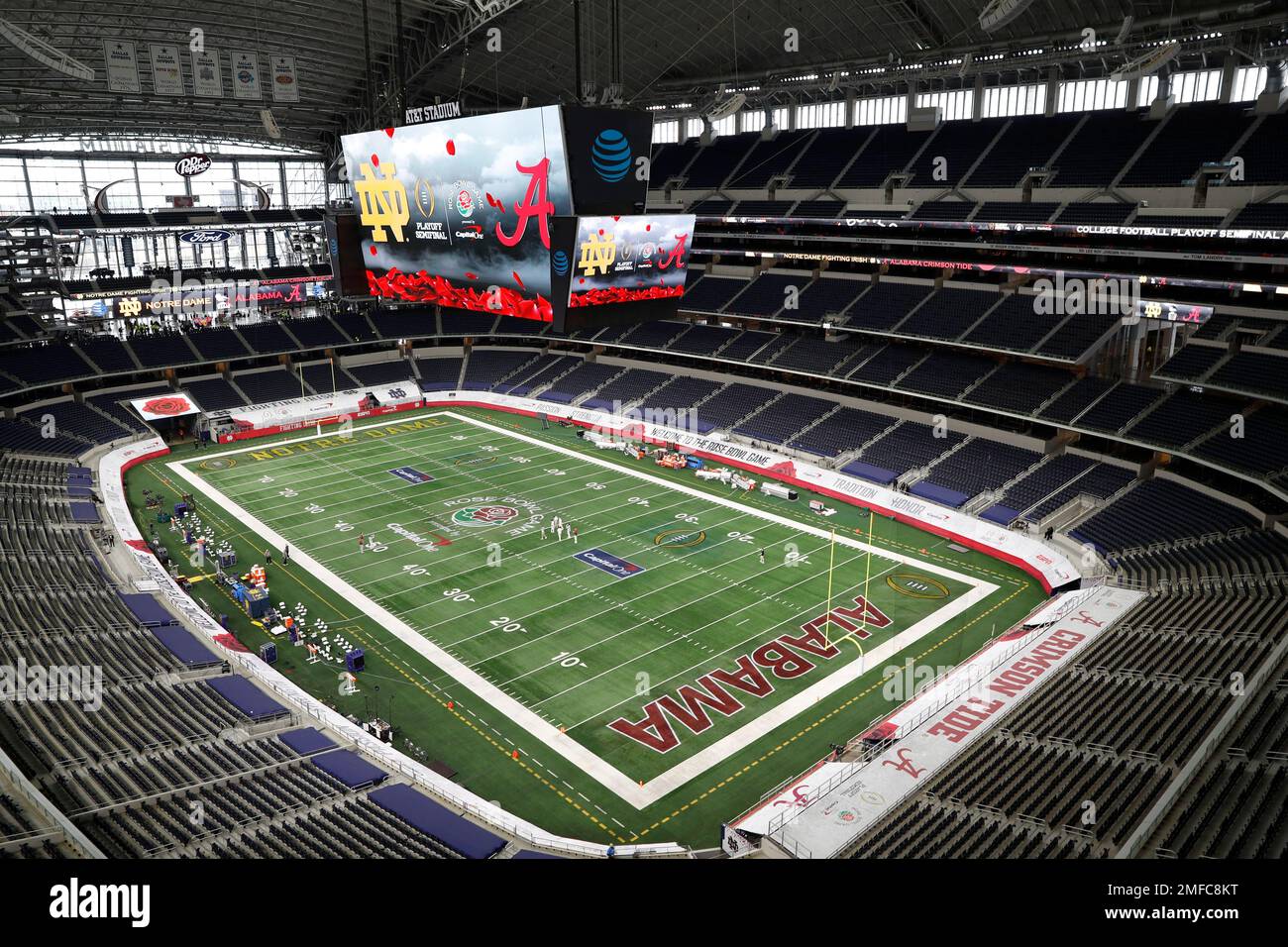 The large video board at AT&T Stadium shows the Notre Dame and Alabama ...