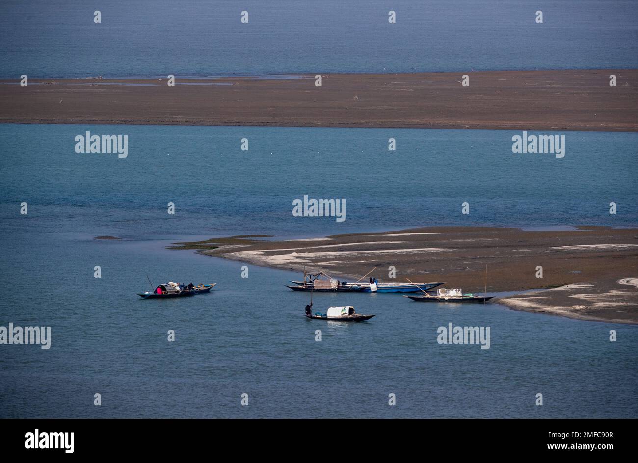Indian fishermen catch fish in the river Brahmaputra in Gauhati, India ...