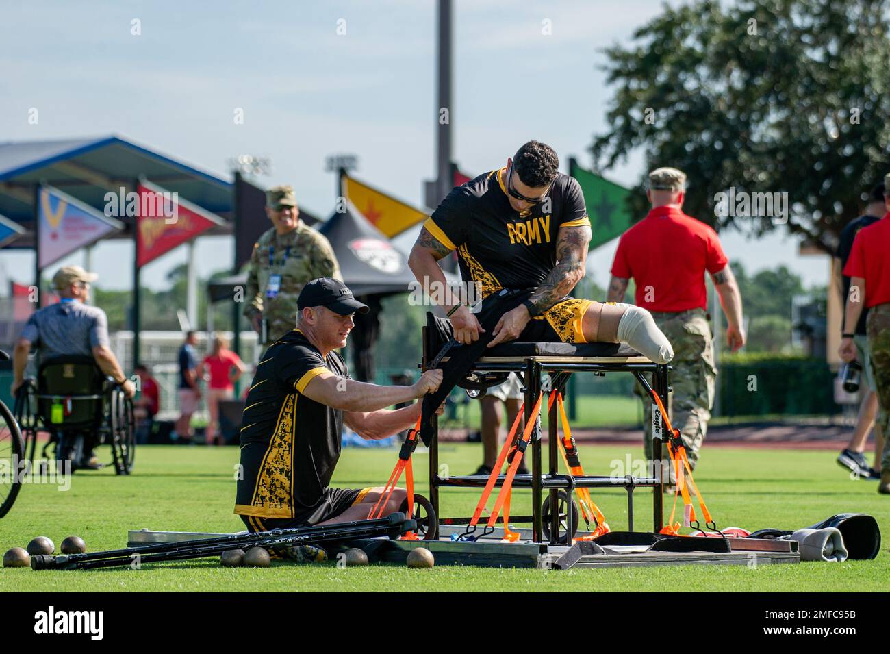 Retired U.S. Army Staff Sgt. Jason Smith gets help from retired Sgt ...