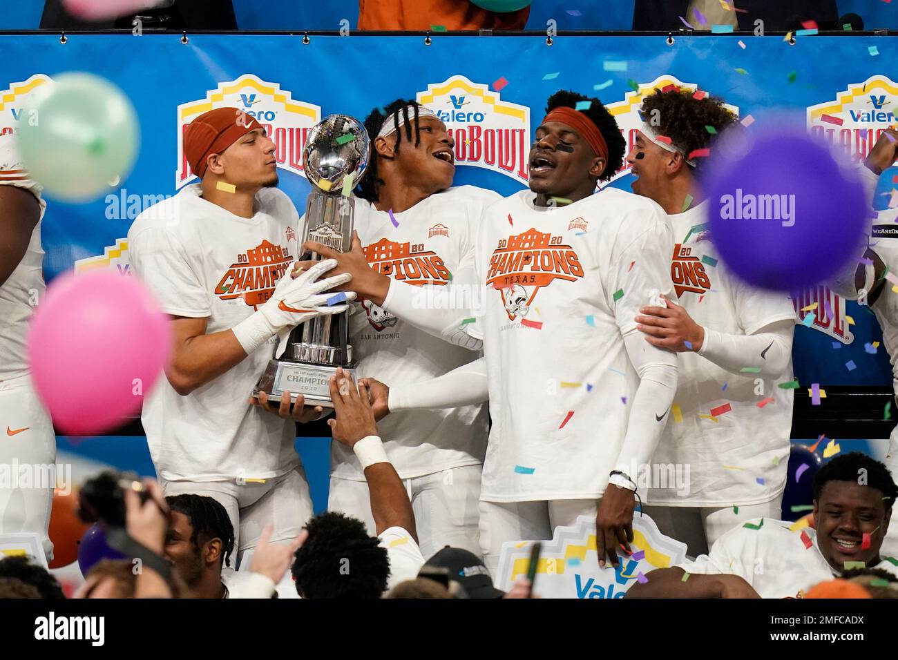 Texas celebrates their win over Colorado in the Alamo Bowl NCAA college ...