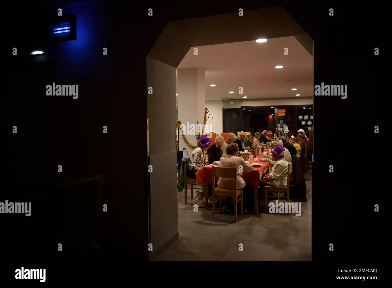 Residents of the San Jeronimo nursing have dinner during New Year's Eve ...