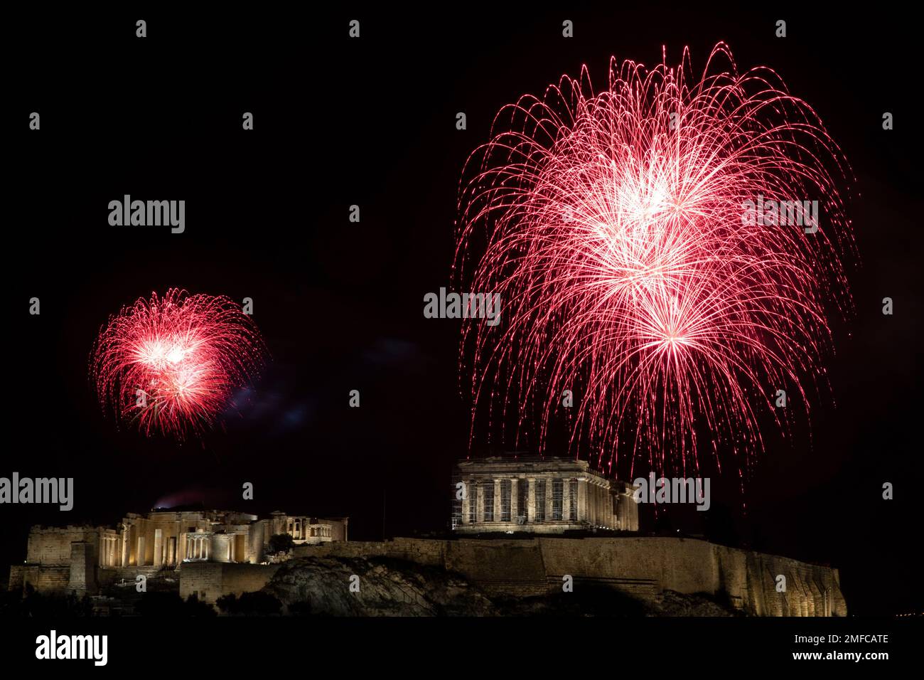 Fireworks explode over the ancient Acropolis hill with the Parthenon ...