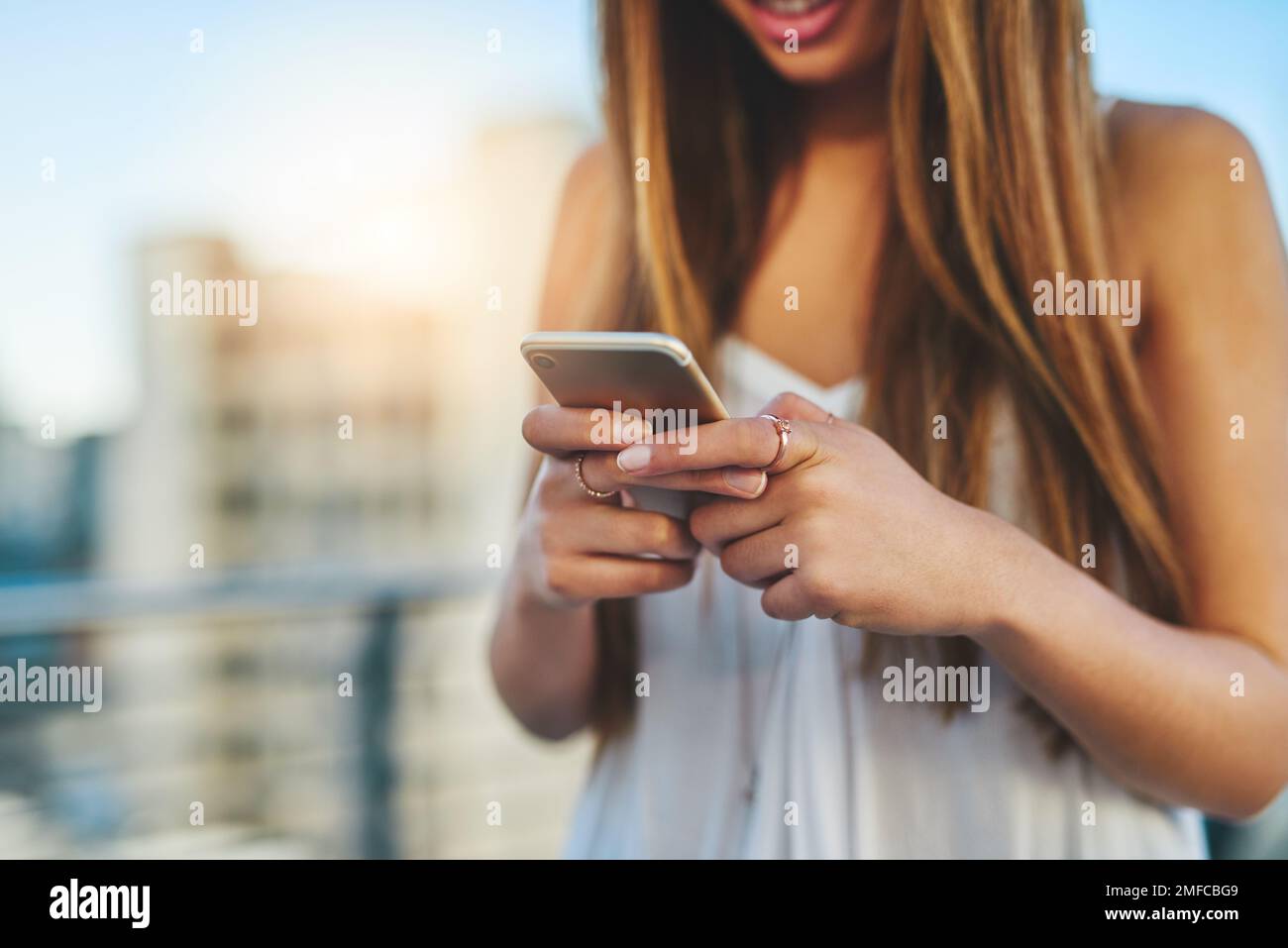 Shes always online. an unrecognizable young woman sending a text ...