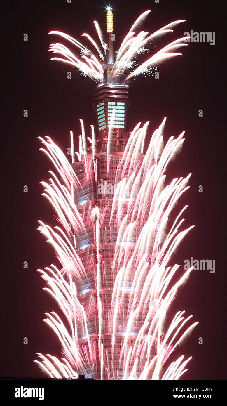 Fireworks detonate from the Taipei 101 building during the New Year's ...
