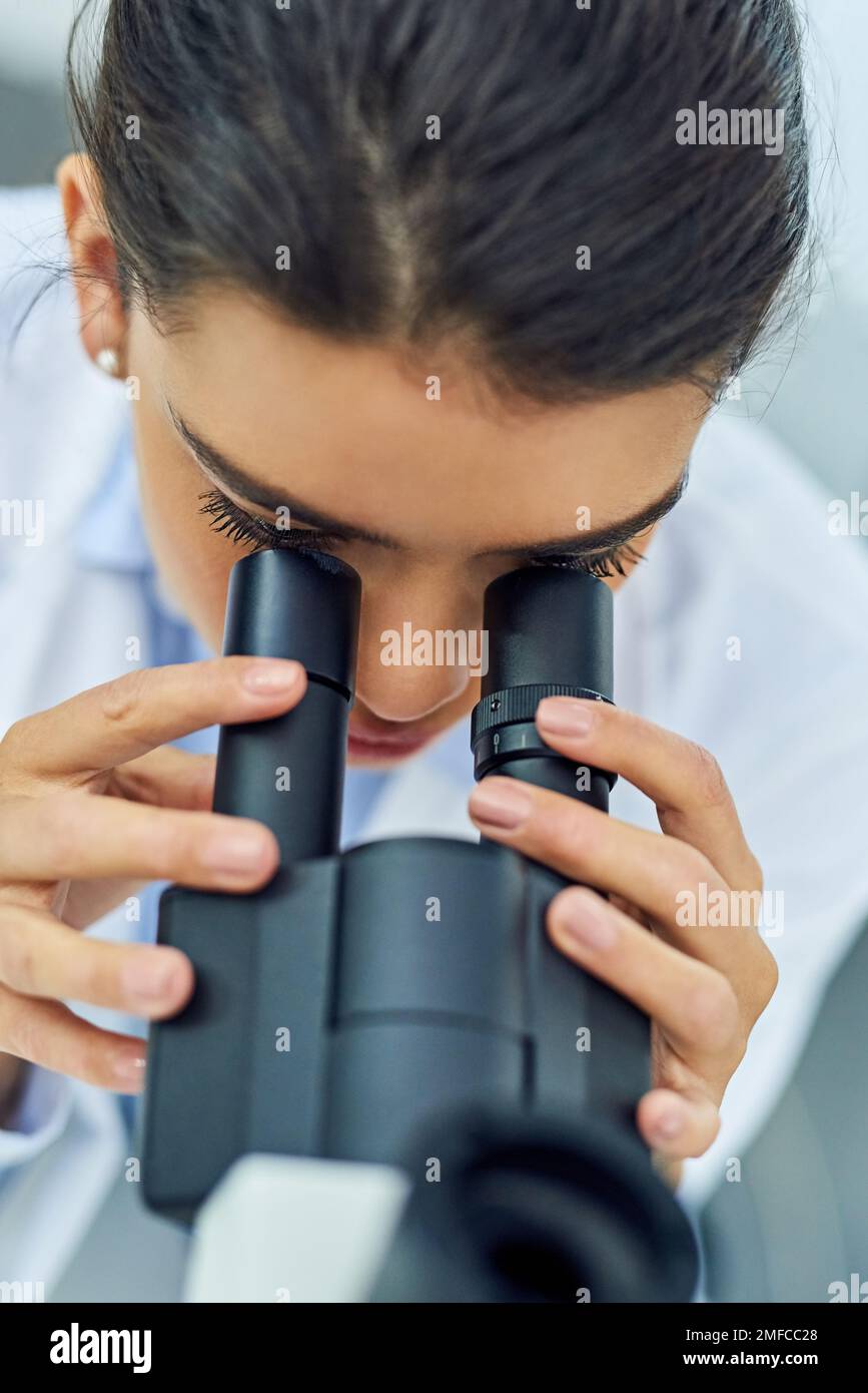 You need a critical eye in this profession. a young scientist using a ...