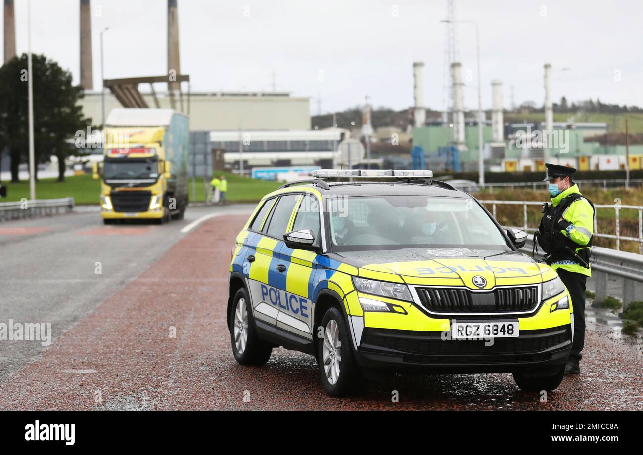 Police patrol the port of Larne, on the north coast of Northern Ireland ...