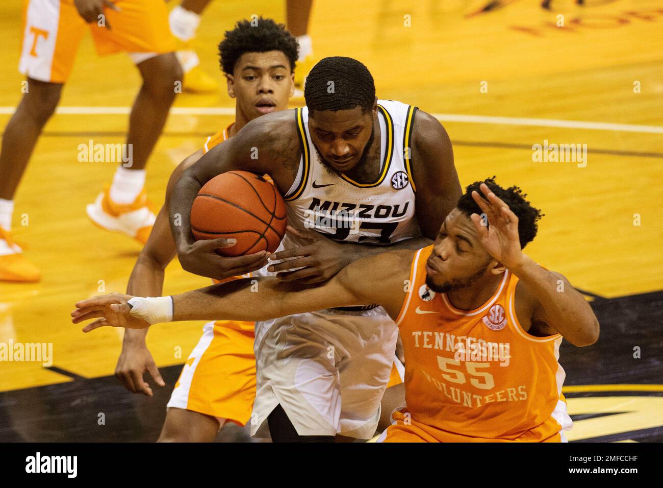 Missouri's Jeremiah Tilmon, center, pulls down a rebound between ...