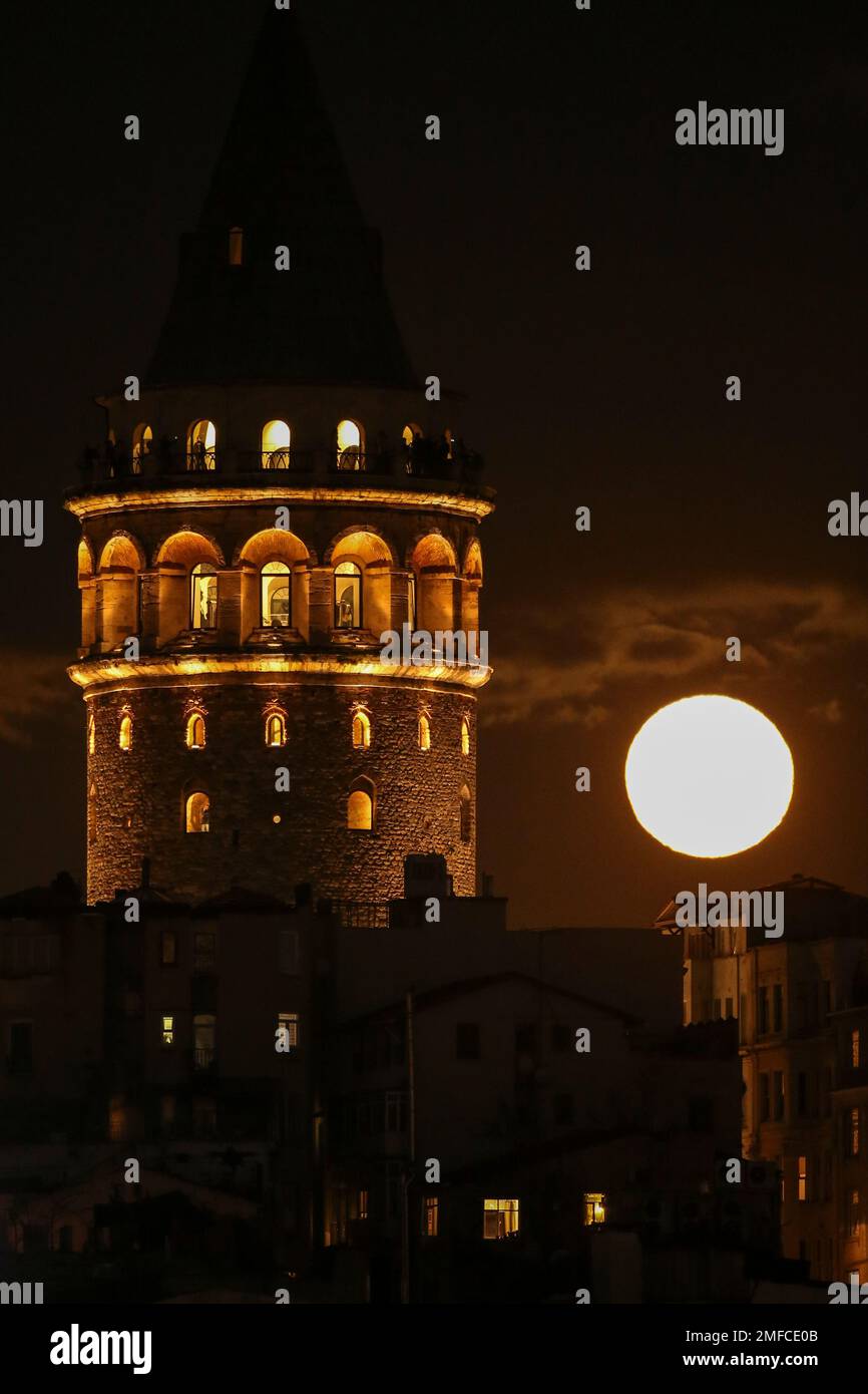 The moon rises over Istanbul's skyline dominated by the iconic Galata ...