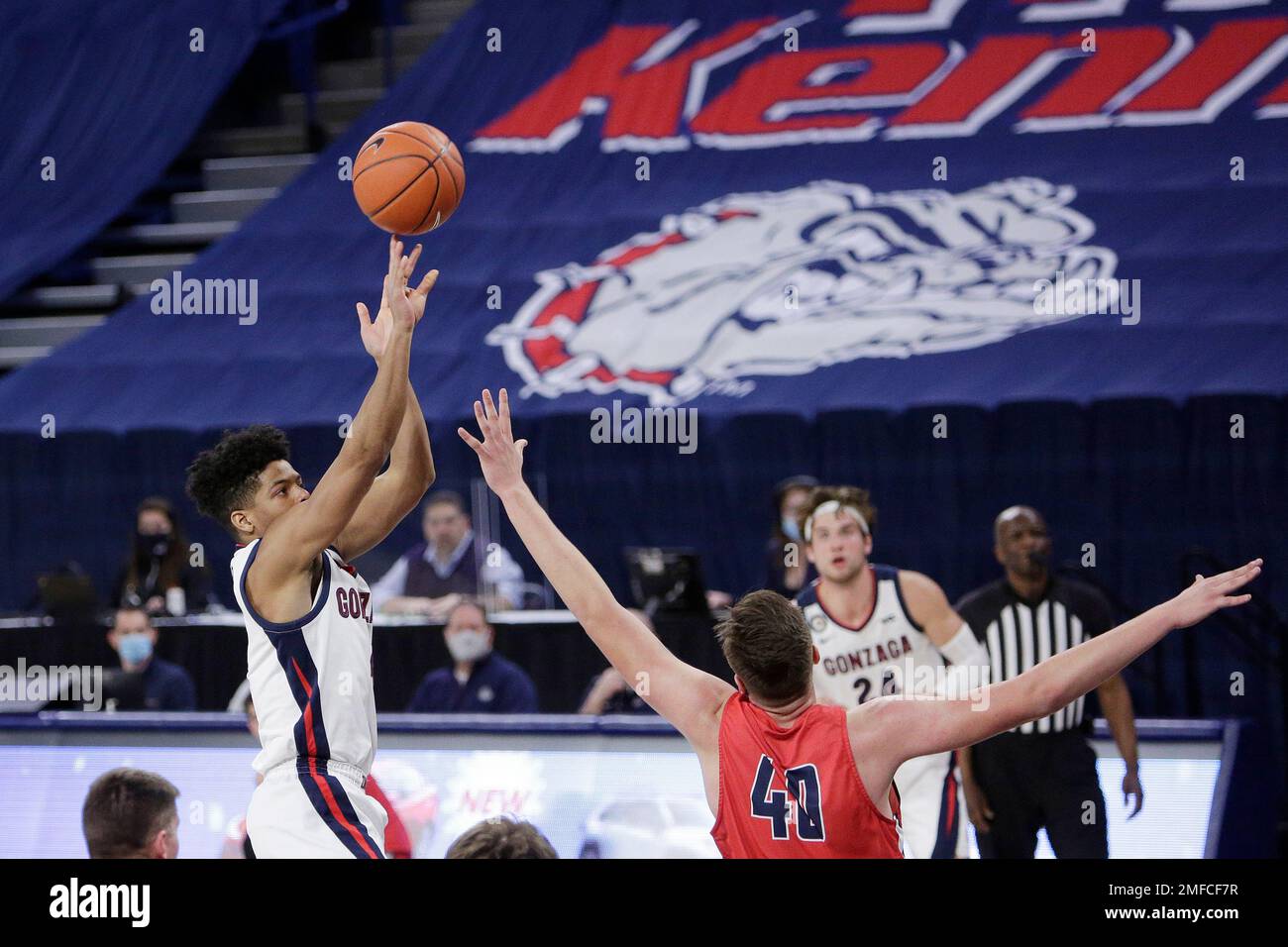 Gonzaga guard Aaron Cook, left, shoots over Dixie State forward Trevon ...