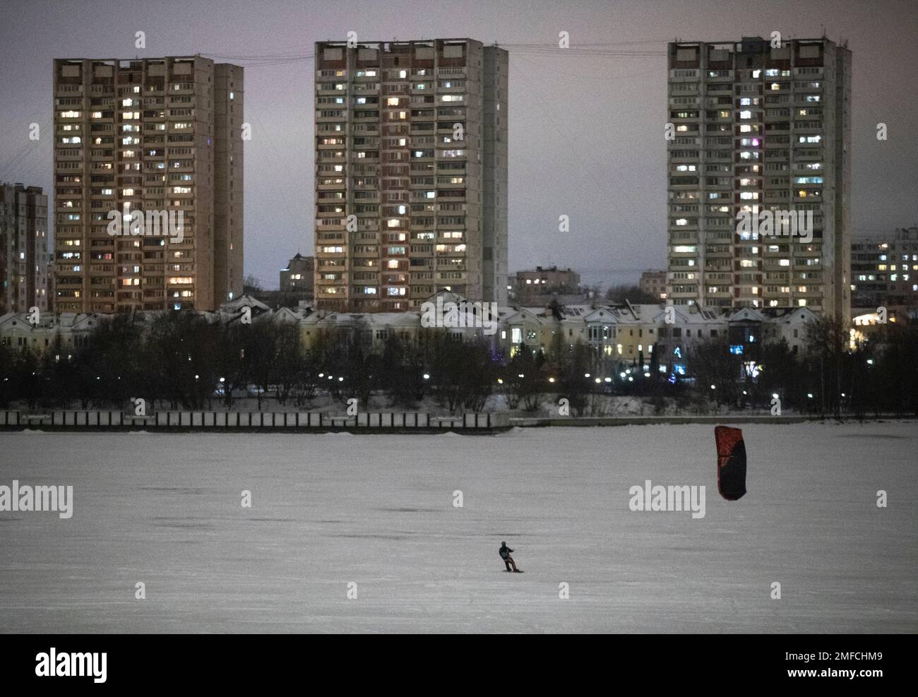 A kite skier slides across the frozen Moscow river in Moscow, Russia ...