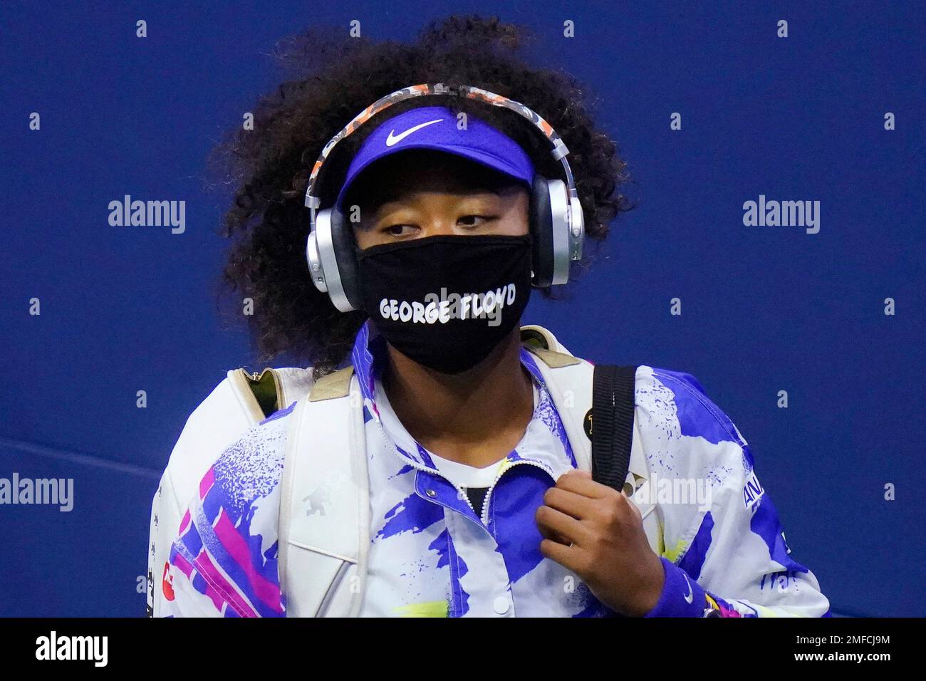 FILE - Naomi Osaka, of Japan, wears a protective mask due to the COVID ...