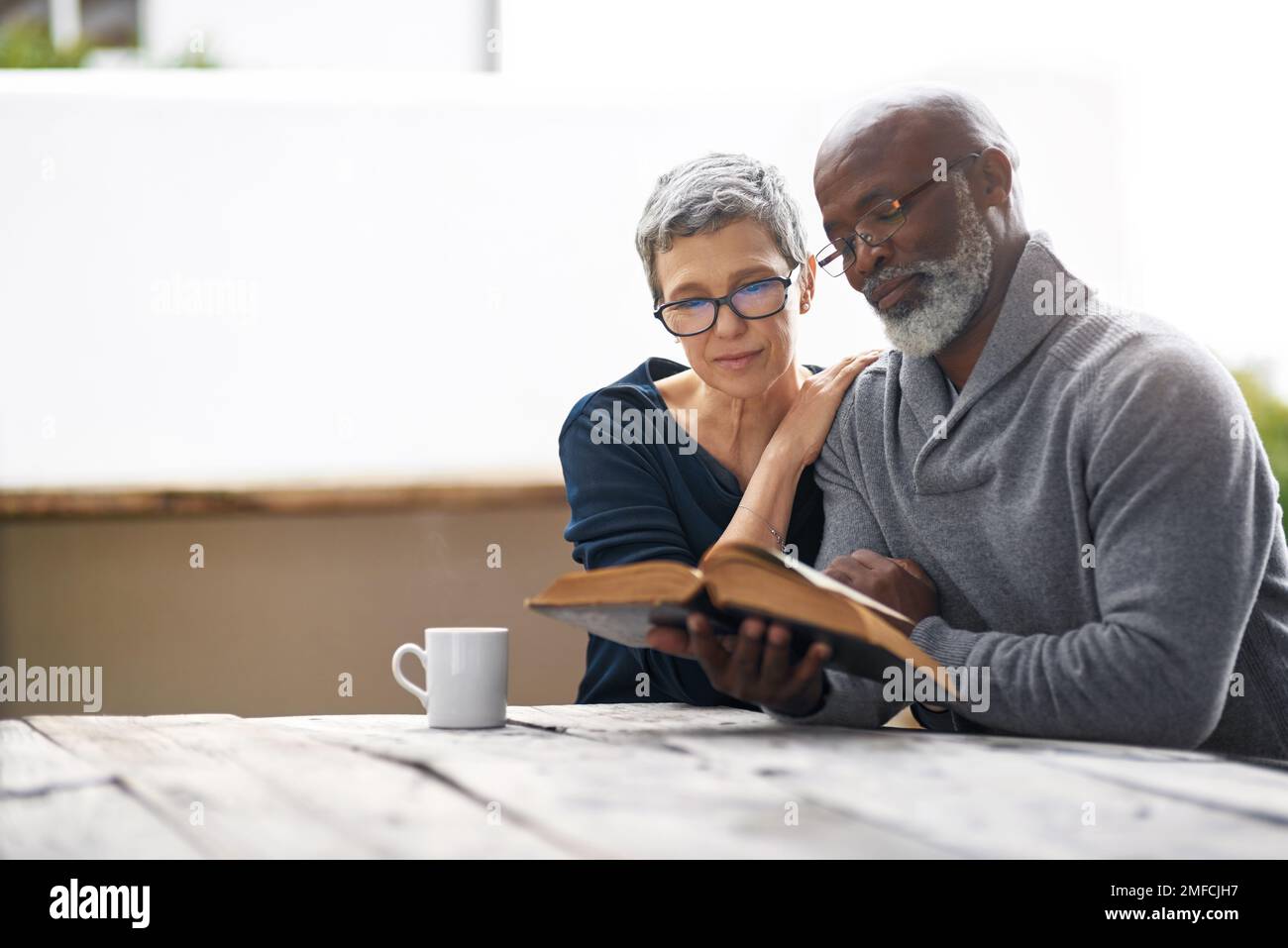 Two women reading bible together hi-res stock photography and images ...