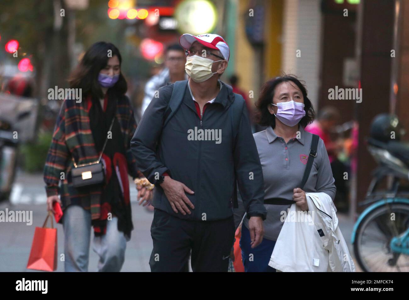 People wearing face masks to protect against the spread of the ...