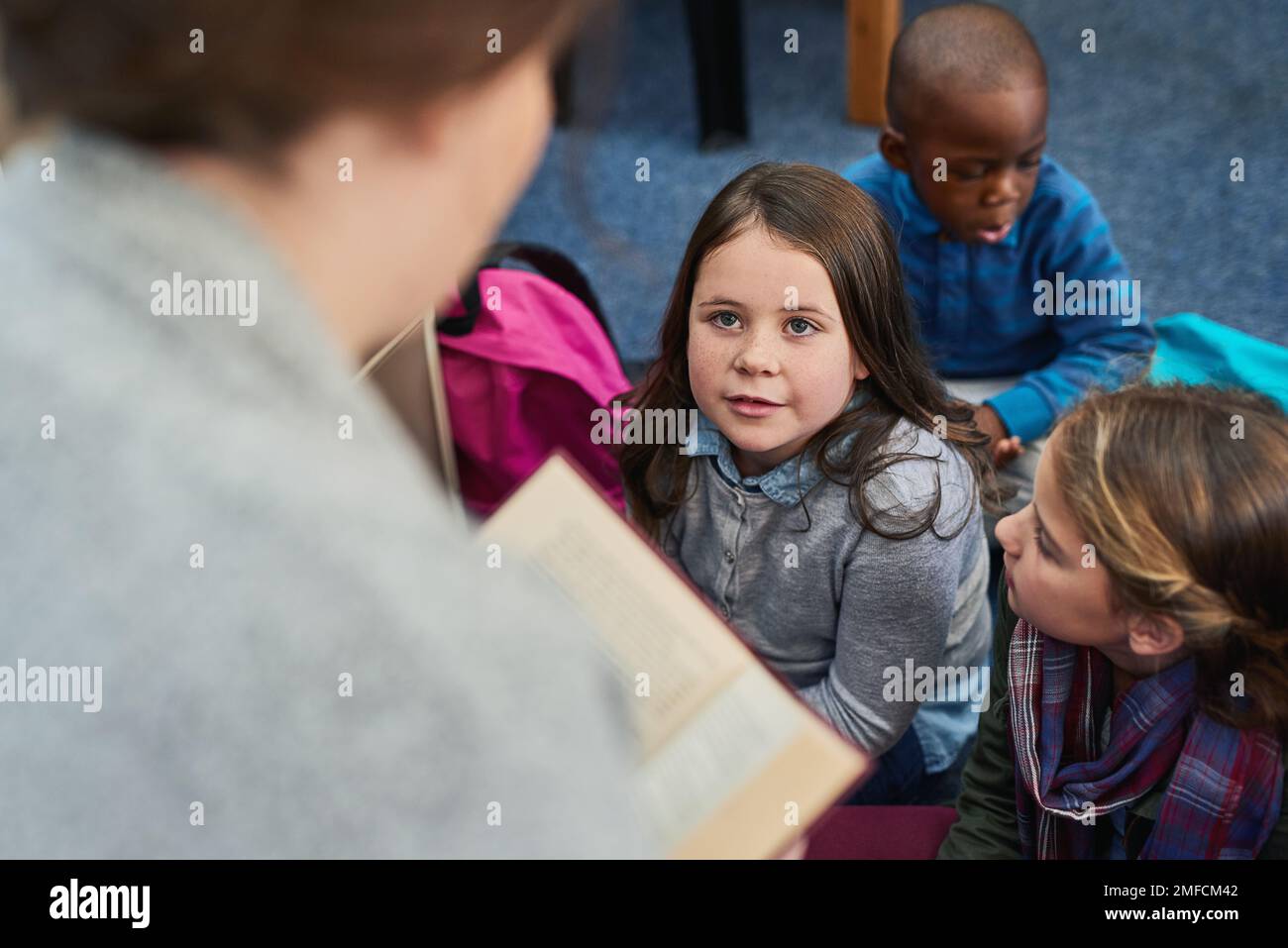 They always listen very attentively when its storytime. a group of ...