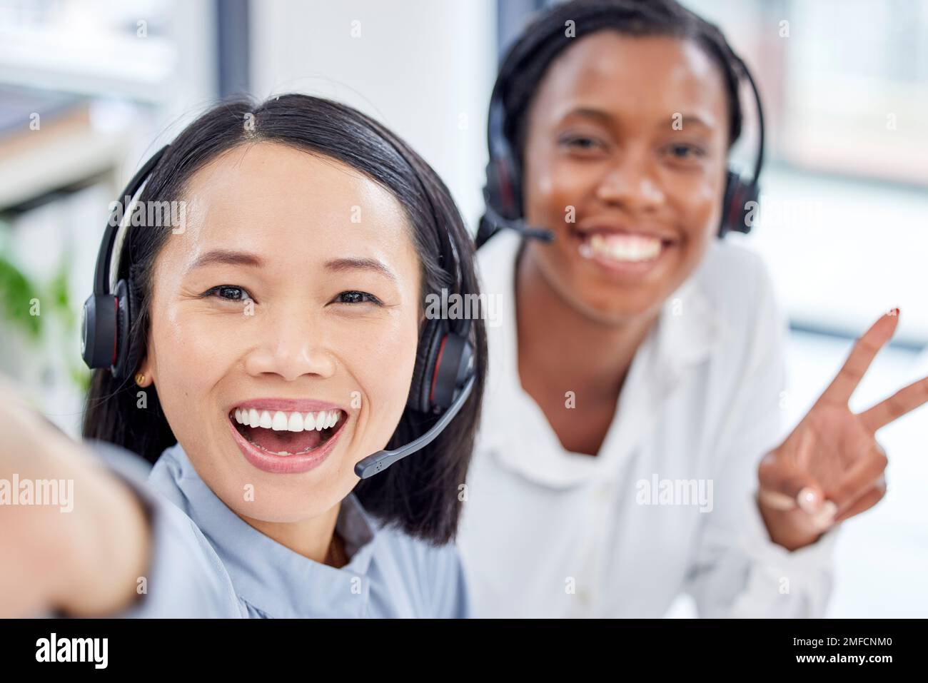 Call center woman, selfie and teamwork with friends, diversity and happiness in crm workplace ...