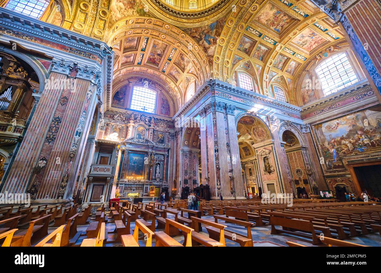 Interior view of the central nave, aisle section with soaring, gold ...