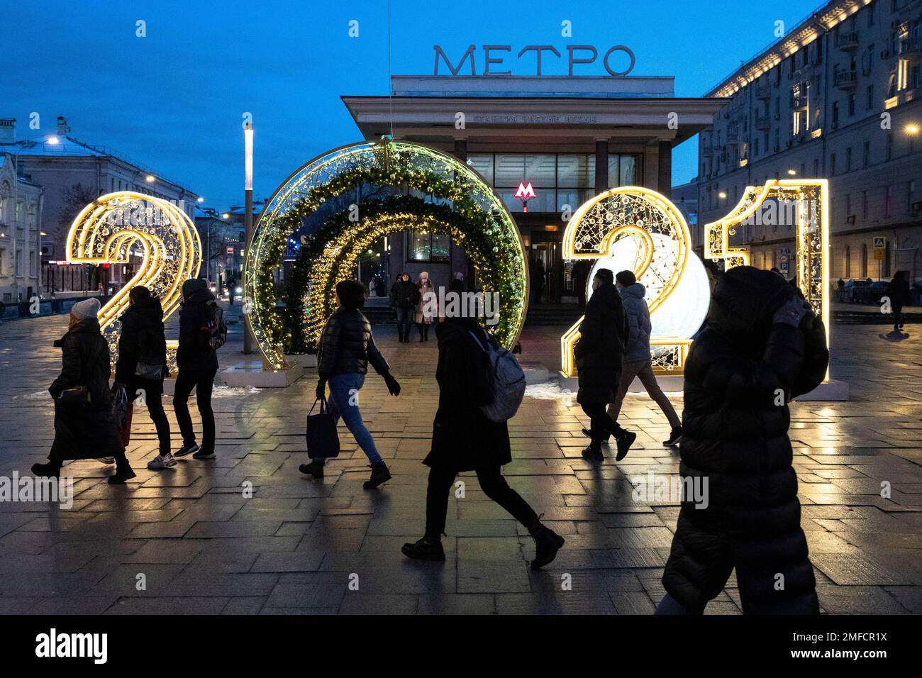 People pass "2021" numbers installed to celebrate the upcoming New Year ...