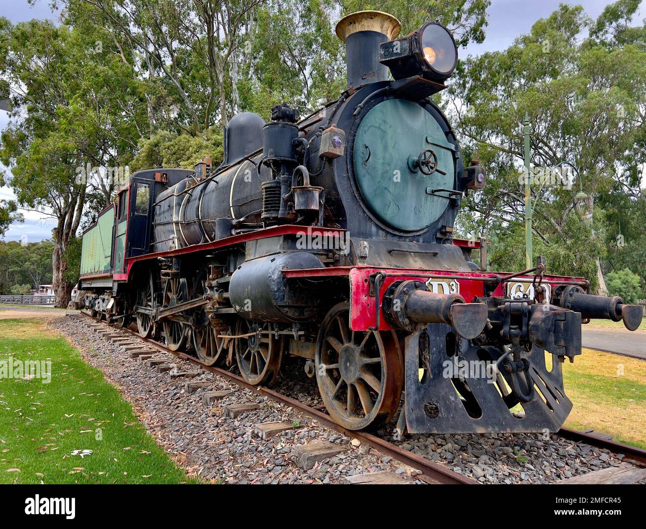 A preserved bold black 1914 DD-Class Steam locomotive captured in a ...