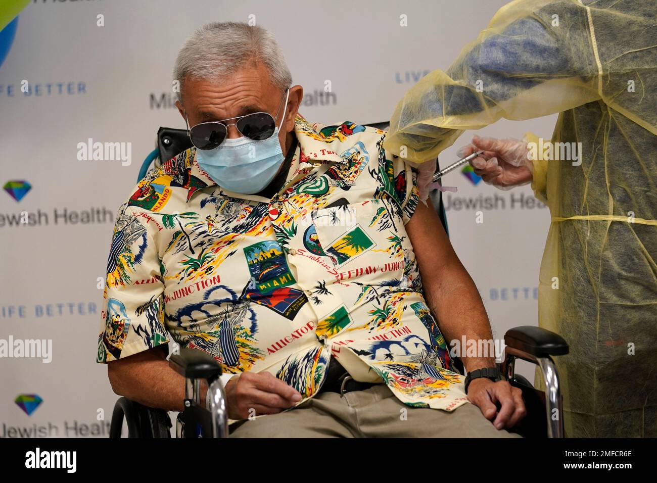 Eulalio Gonzalez, 82, is inoculated with the Moderna COVID-19 vaccine ...